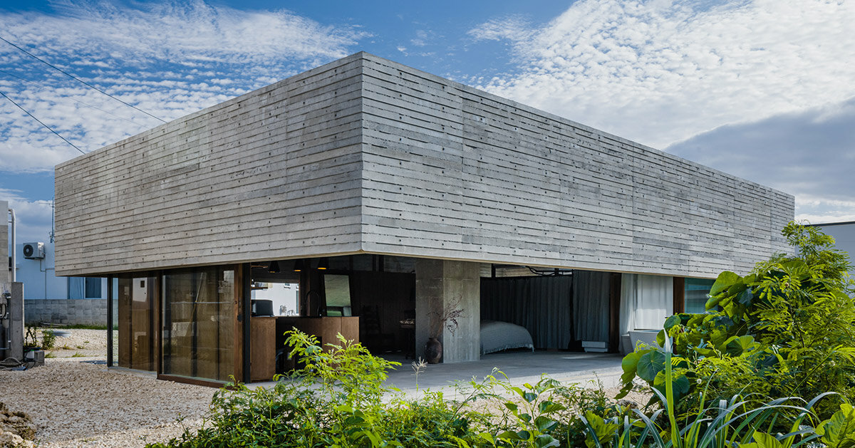 house in japan extends around a single column like an open umbrella