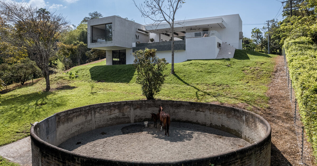 concrete residence expands cantilevered volumes in rural colombia