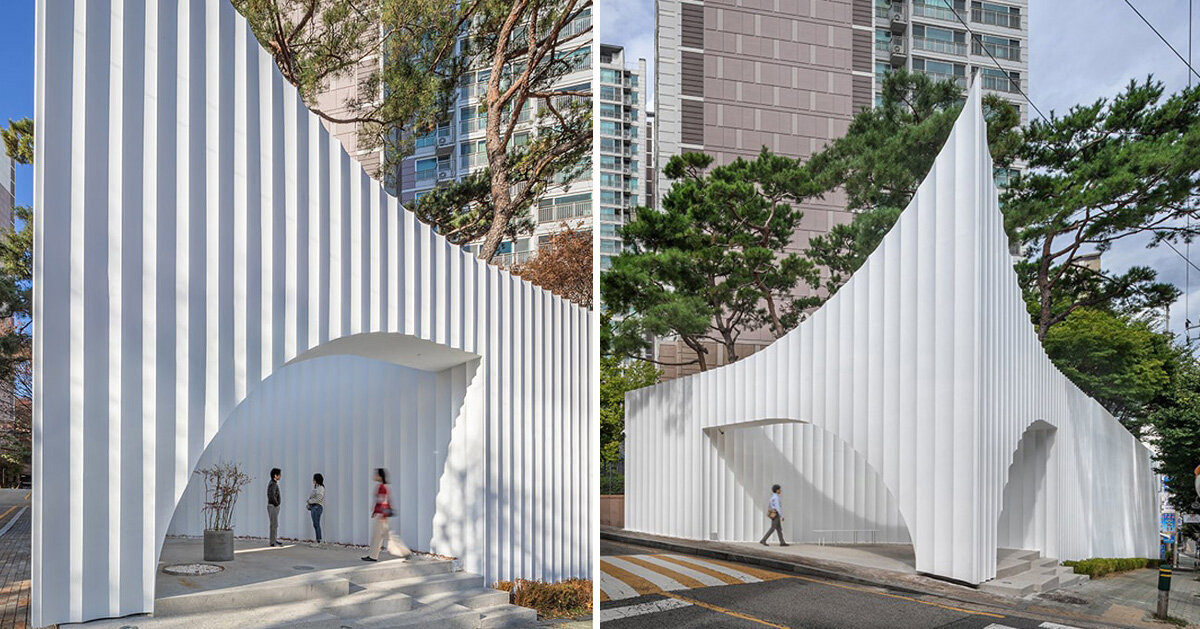 drawing works' white wing pavilion forms apartment entrance, south korea