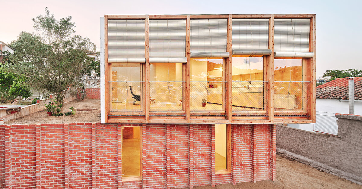 ágora arquitectura stacks CLT house atop old brick base in spain