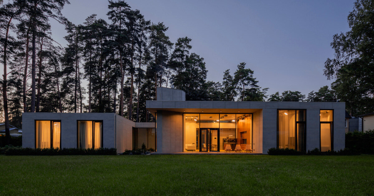 concrete residence in latvia unfolds two distinct dynamic volumes