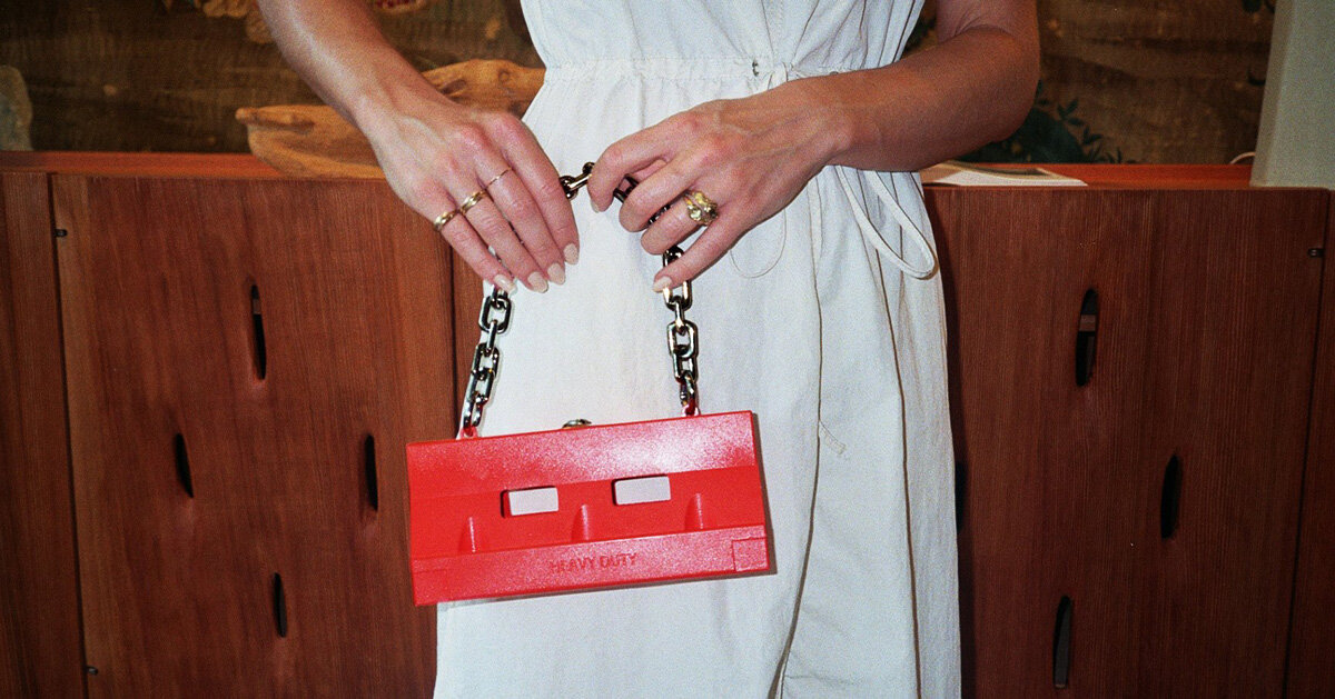 chris luu captures urban charm of street barricades in a resin purse