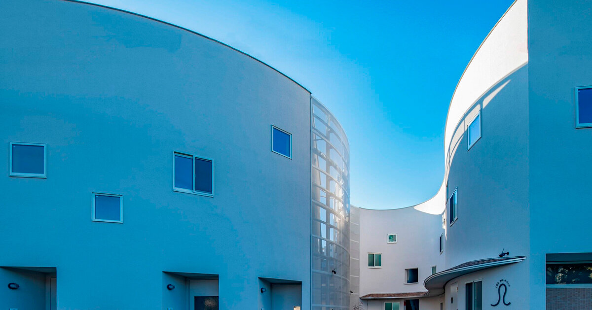 curved residential development shapes a vibrant 'pocket' in japanese city