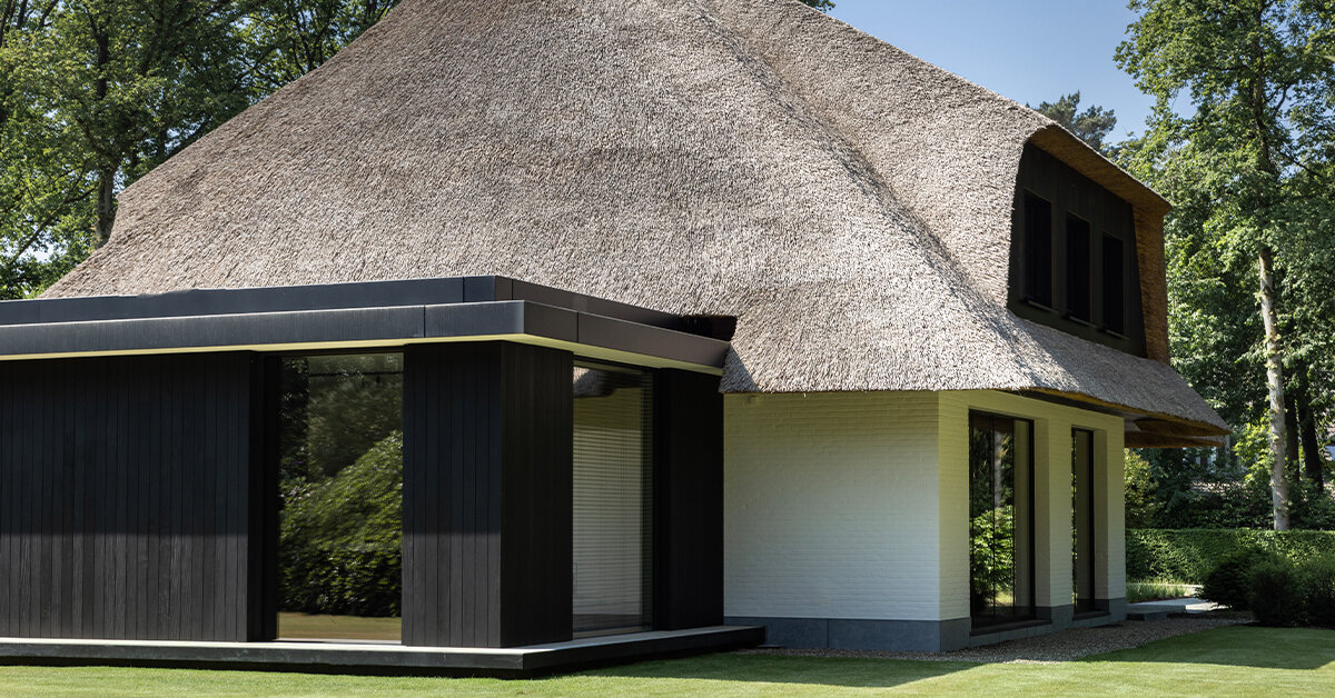mieke van herck architects' sleek extension for thatched-roof house