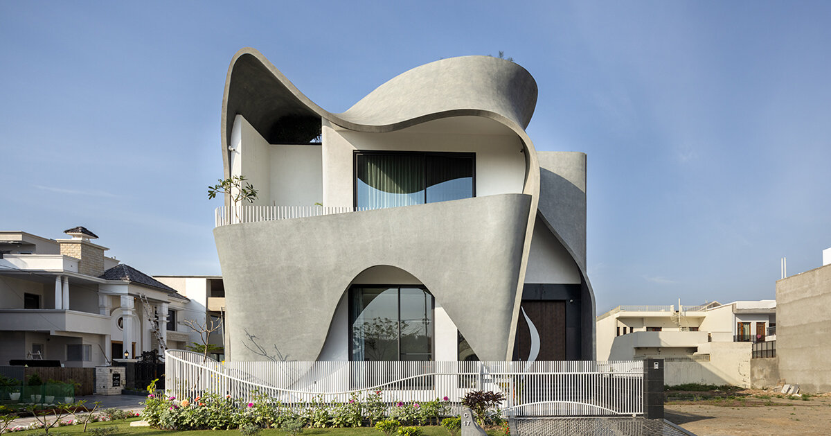 concrete ribbon wraps around studio ardete's residence in india