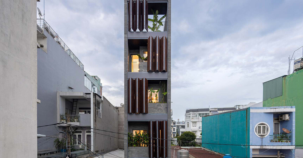 folding teak shutters envelop pham trung's narrow home in vietnam