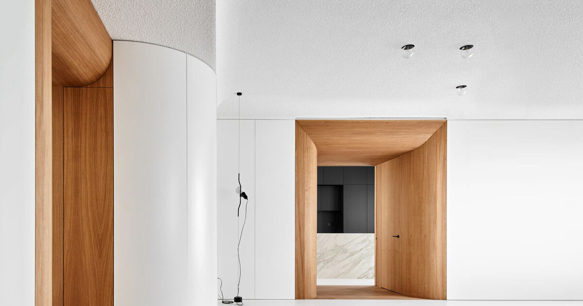 wooden curved casings frame domestic scenes within home in madrid