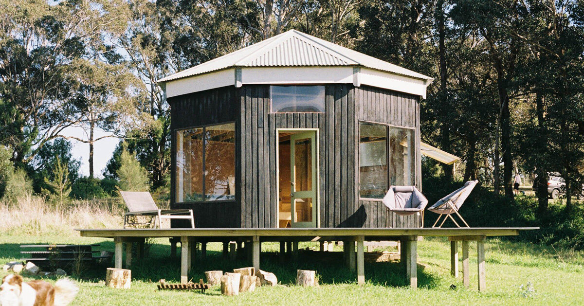 trouthouse revitalizes museum as charred wood cabin in australia