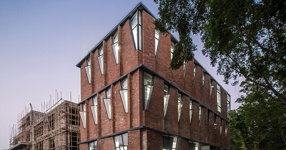 red brick facade with angular windows enfolds multi-use building in china