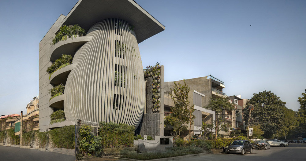 atrey design studio's tilted workspace resembles the swaying trees