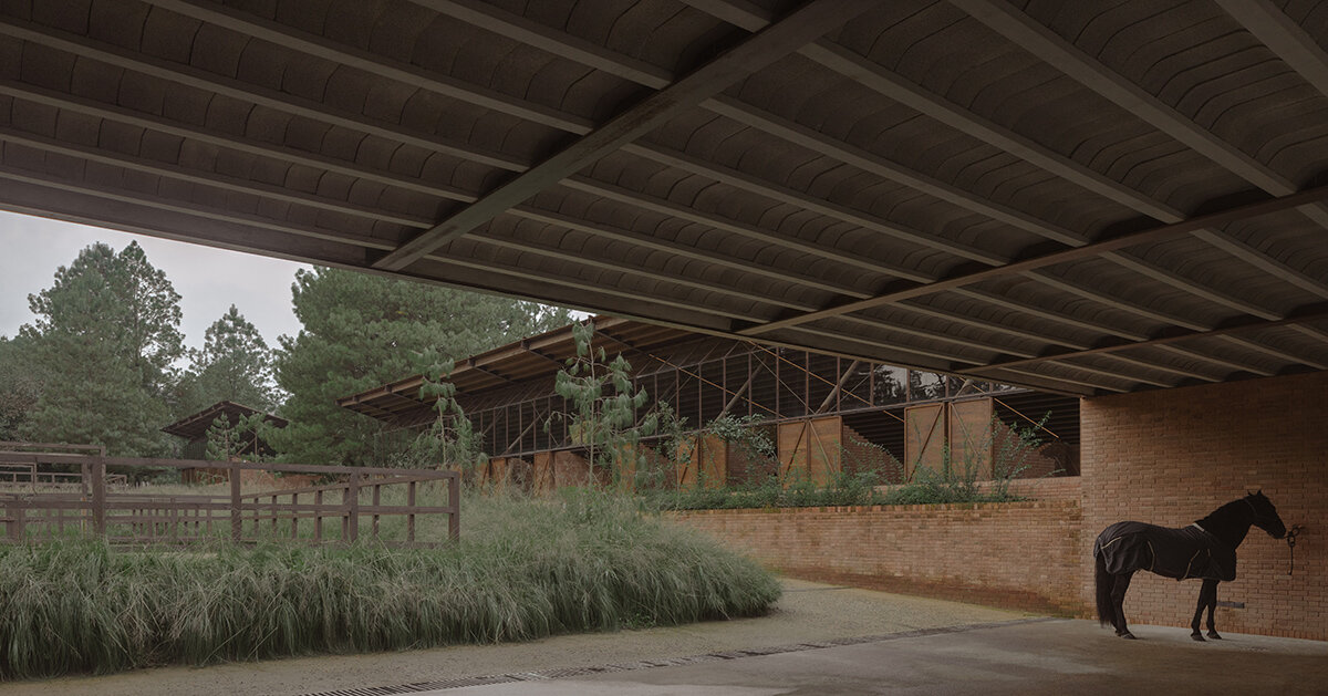 rustic horse stable by módica ledezma blends into its lush mexican setting