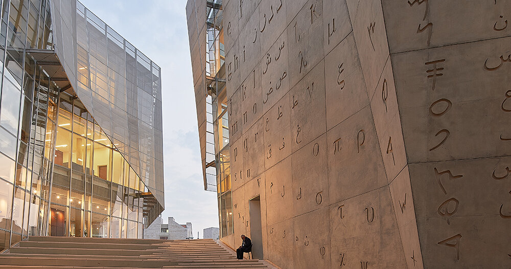 ancient alphabets carved into the facade of jabbra library in lebanon