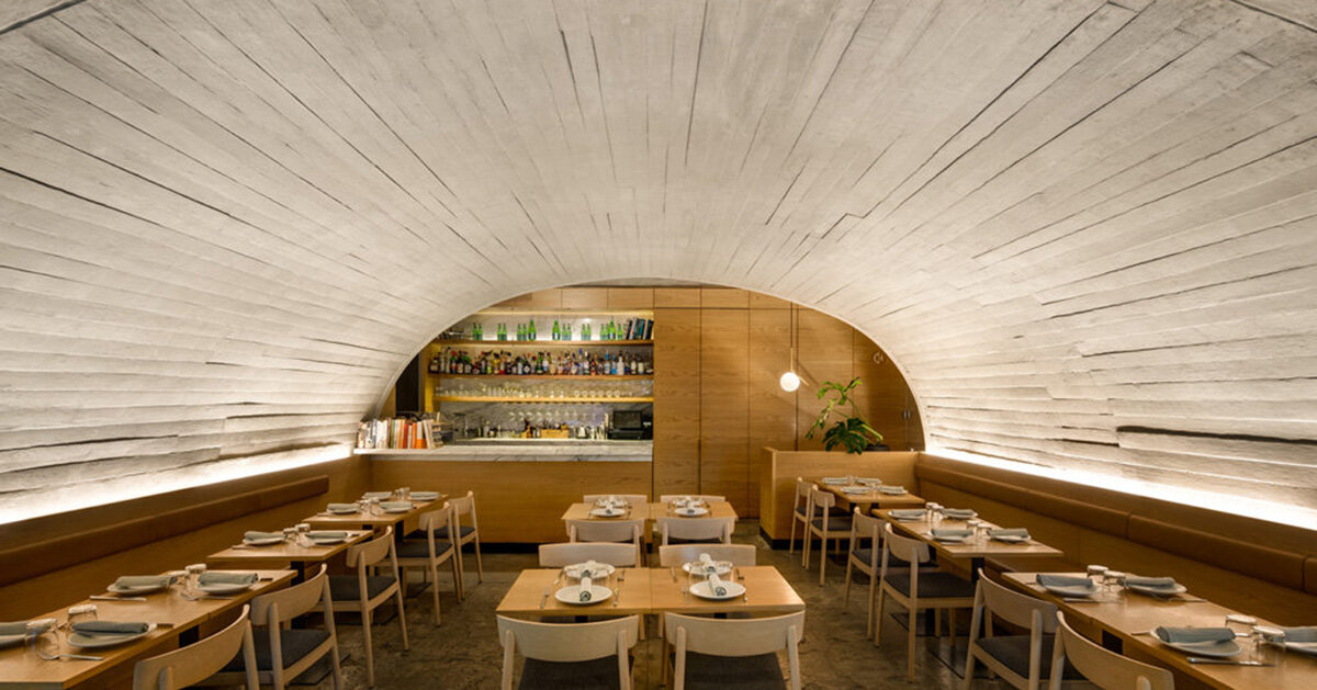 concrete arched vault shelters café-restaurant dining area in mexico city