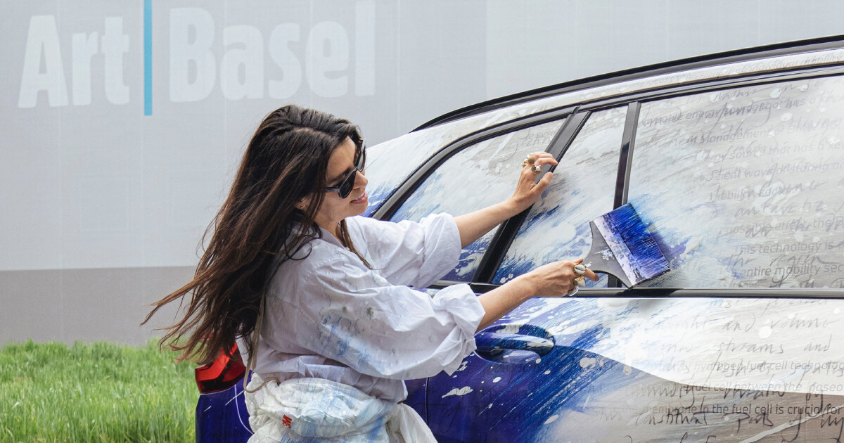es devlin wraps BMW iX5 hydrogen in blue & white collage at art basel
