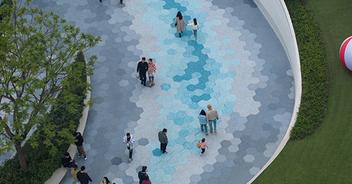 ocean wave-like paving by zaha hadid architects sweeps over chinese ...
