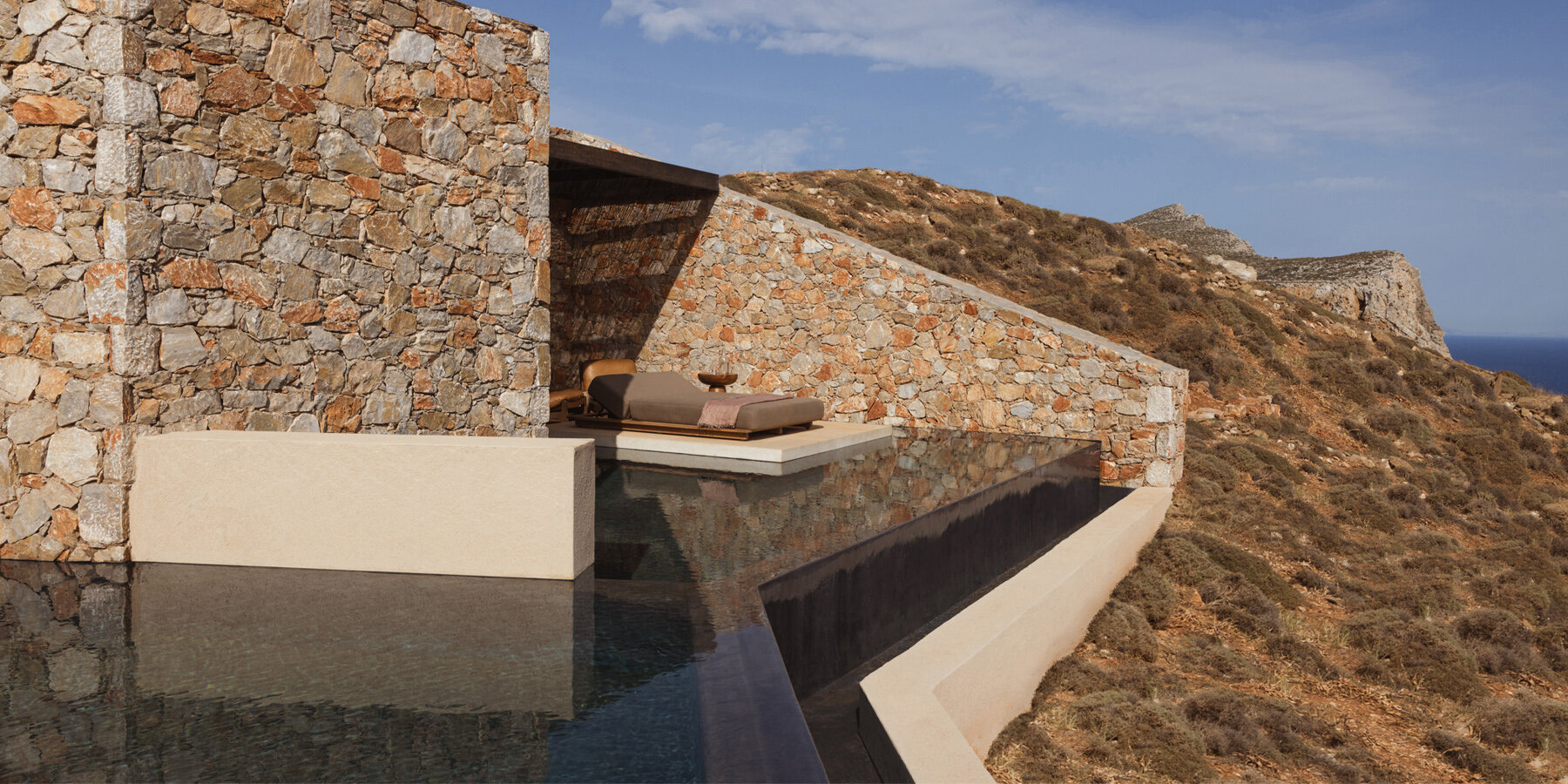 block722's gundari resort carves through the folegandros cliffs in greece