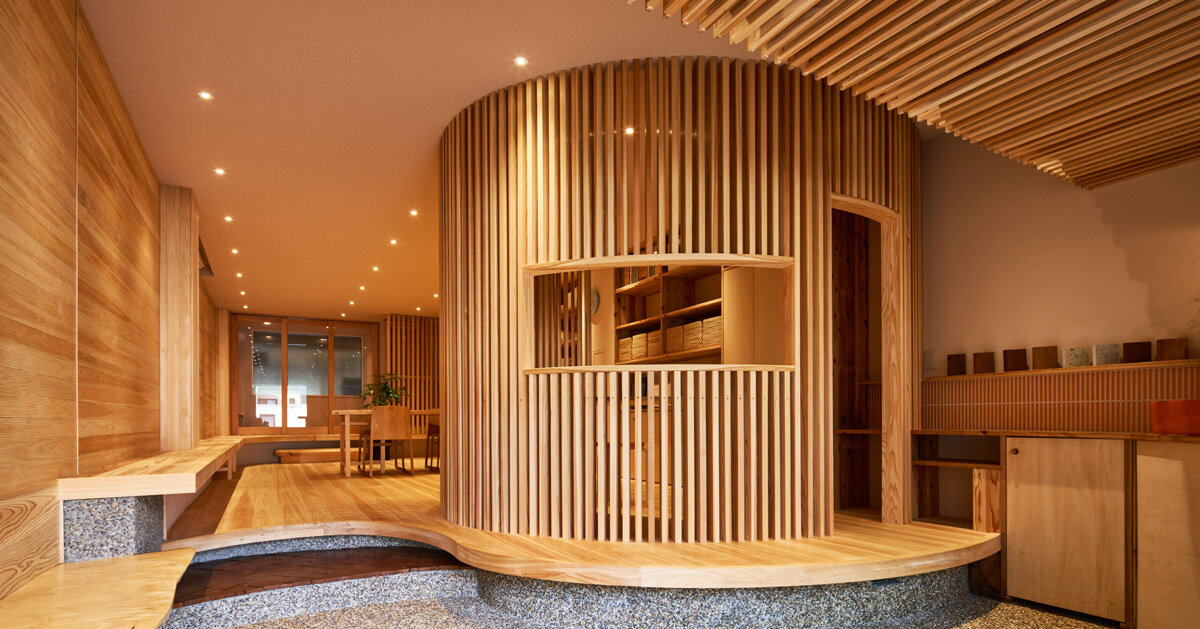 wooden louvers run along kyoto office space's entire interior by ujizono architects