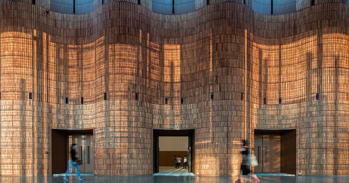 undulating wooden panels form veil-like facade in vietnamese conference ...