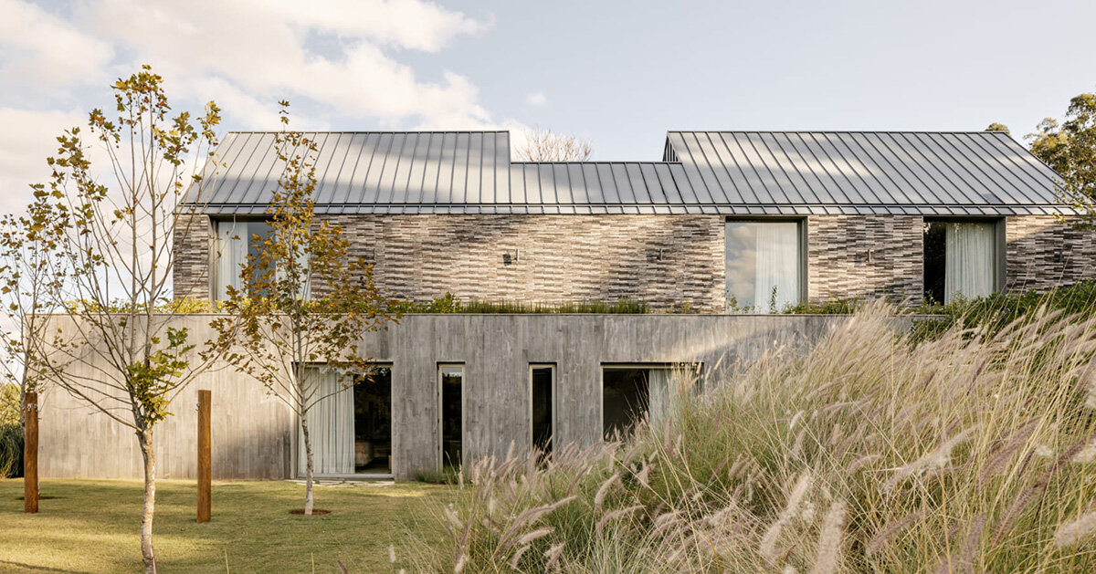 gable roof openings illuminate internal gardens within barn house in brazil