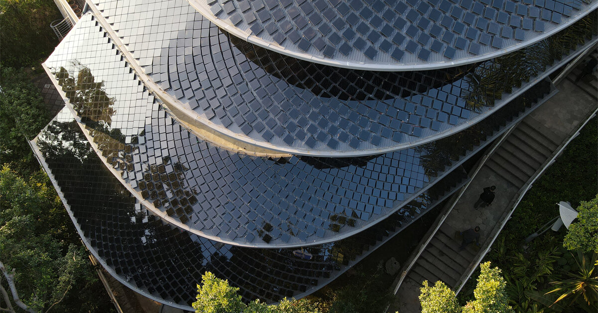 curvilinear solar roofs outline this positive energy house in shenzhen