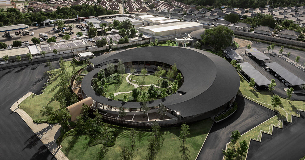 mobius studio designs 'egg yolk' shaped building in thailand