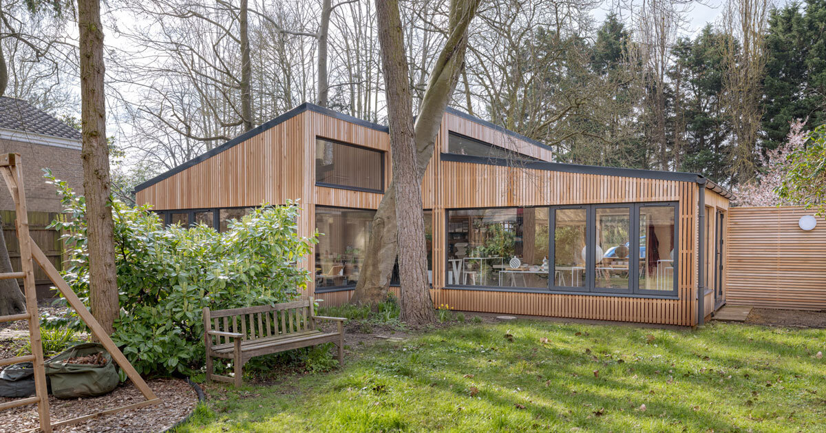 ceramic artist's wood-clad studio extends 80s-built house in the UK