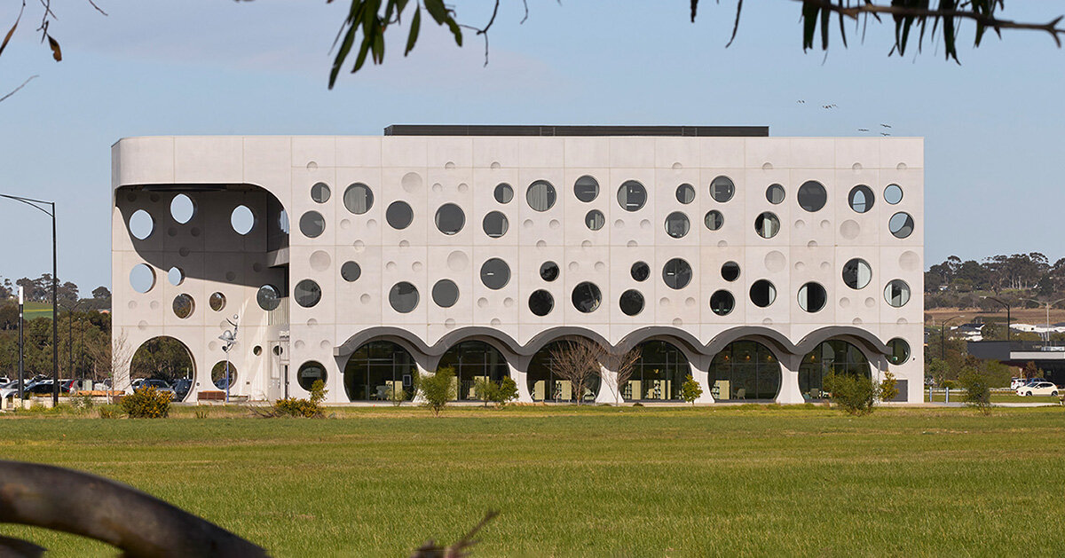playful, circular windows punctuate buchan's library expressive facade ...