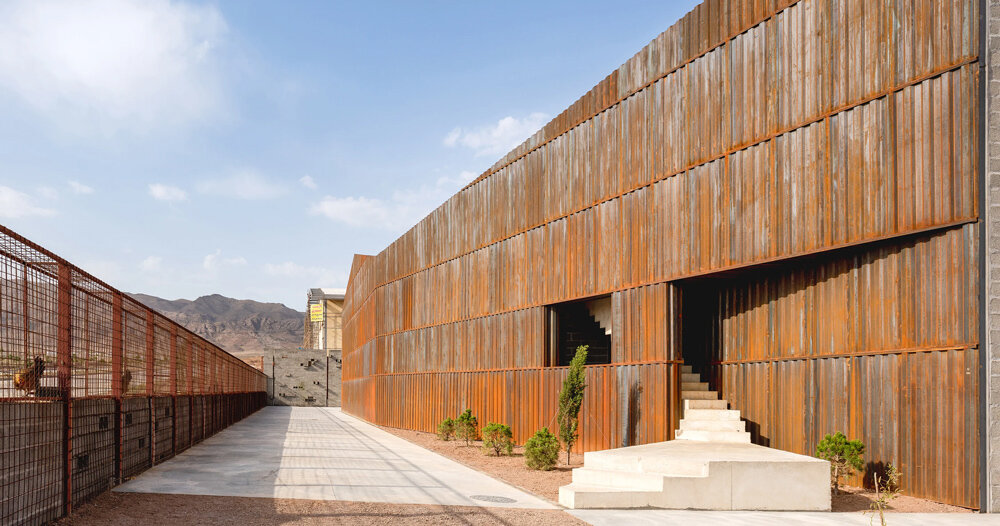 davood boroojeni clads iranian factory building in raw iron sheets