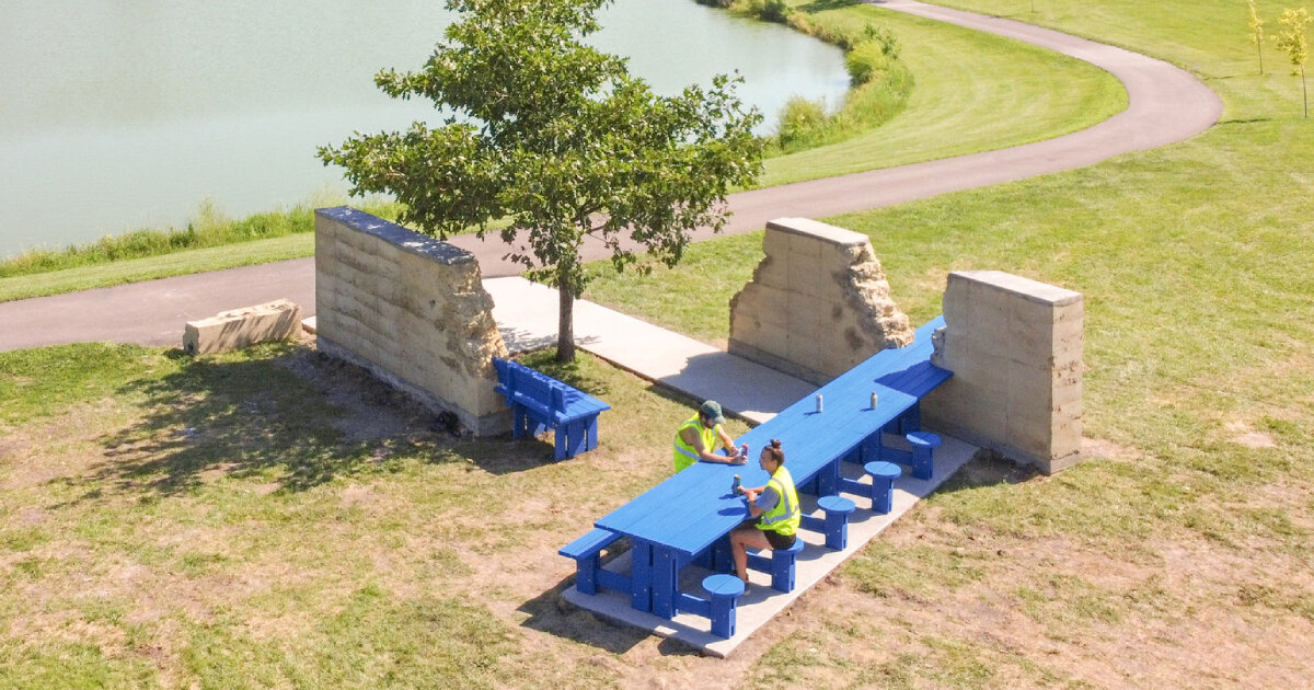 picnic table and bench intersect i/thee's eroded rammed earth walls in ...