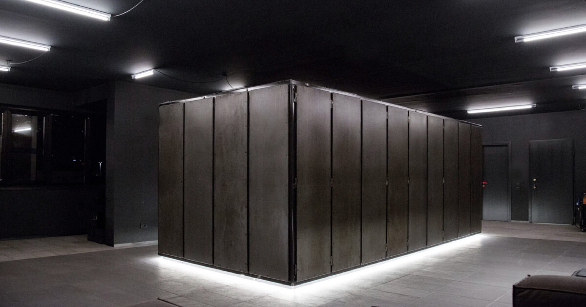 monolithic metal module hosts workspace, lounge, and kitchen at ...