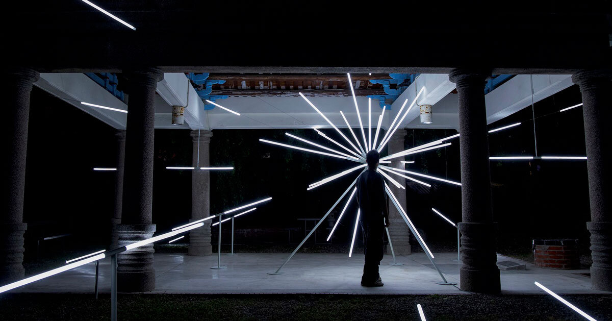 starburst installation spreads illuminating rays within temple in taiwan