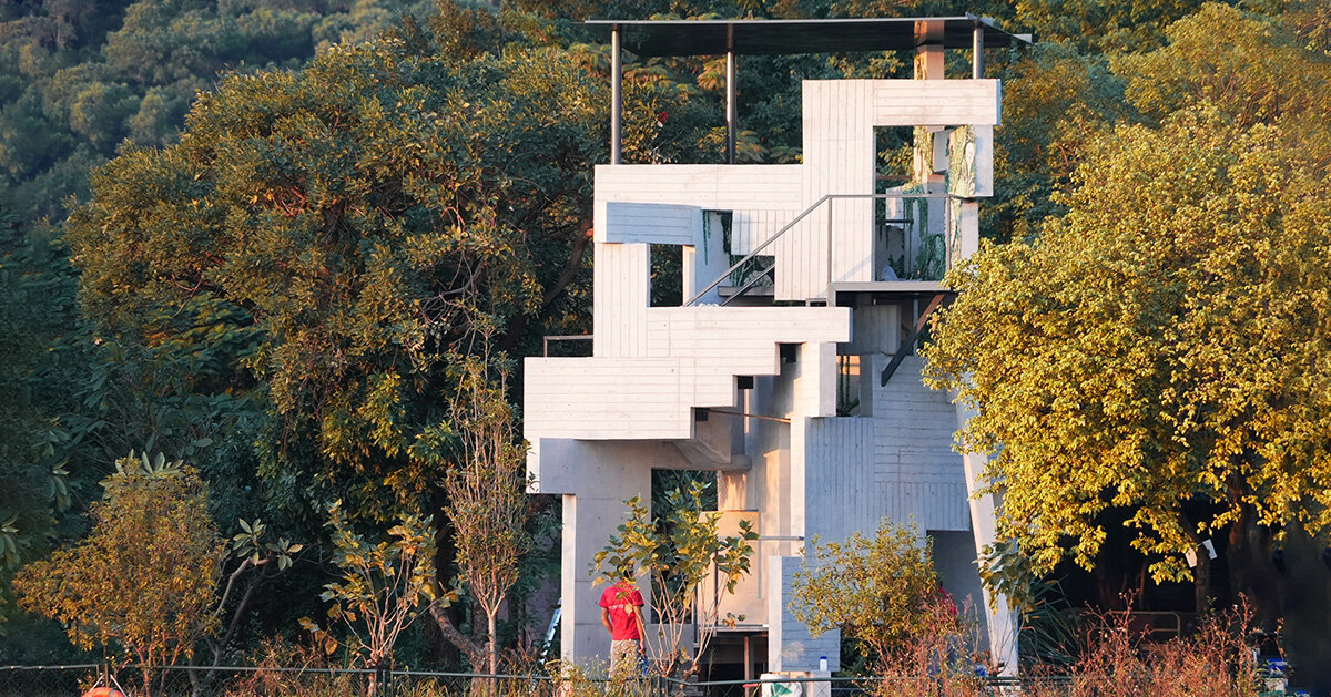 vertical tower by CLAB architects rises from concrete walls in china