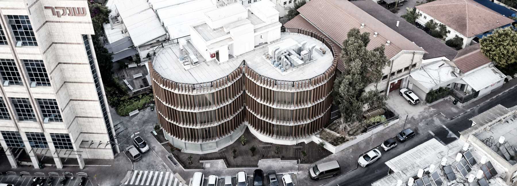 two translucent cylinders of wooden louvres extend the design college ...