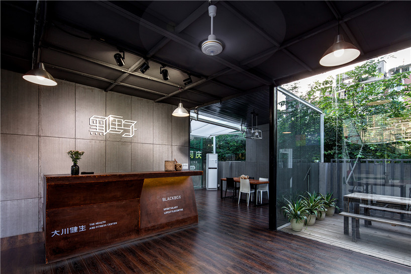 black box gym by epos architects is defined by metal + glass