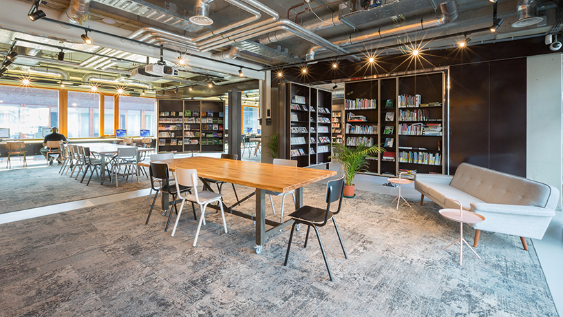 aat vos' new library has an inviting character with a high entrance and ...