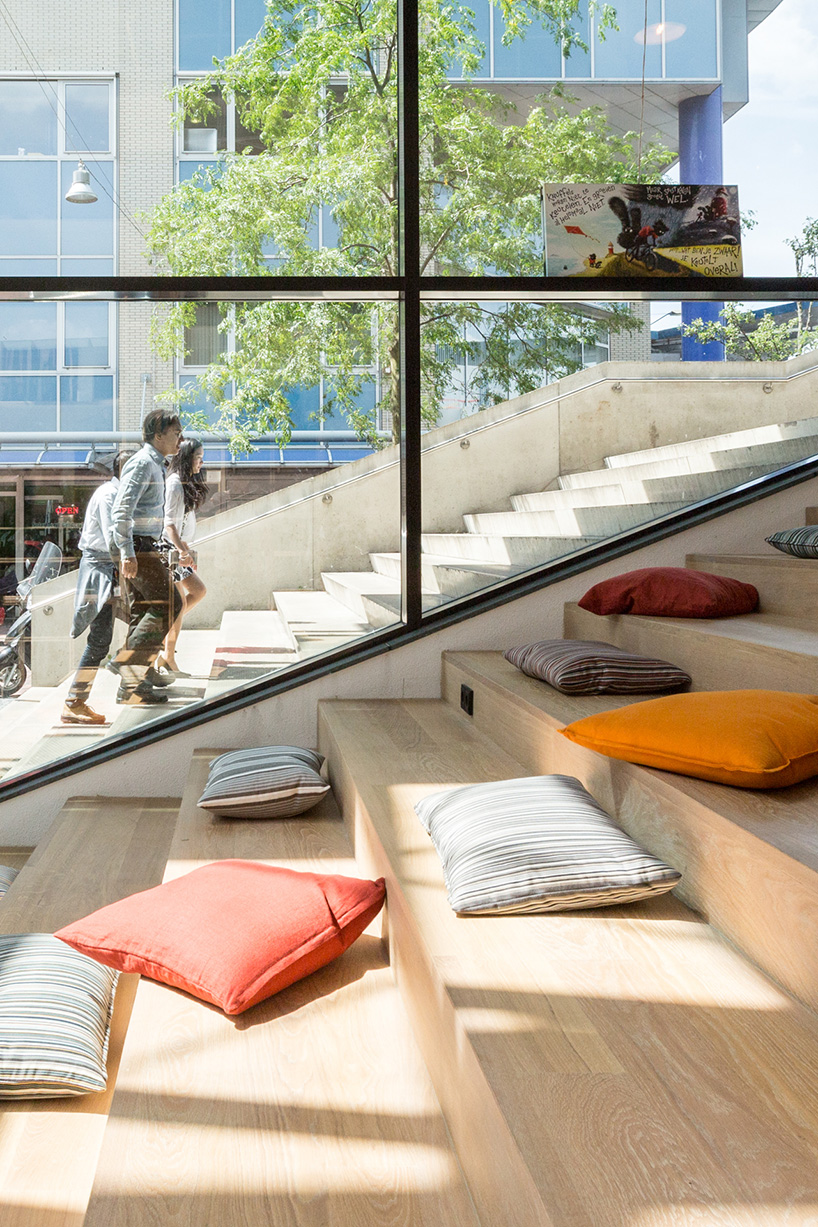 aat vos' new library has an inviting character with a high entrance and ...