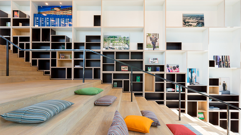 aat vos' new library has an inviting character with a high entrance and ...