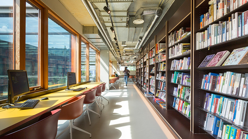 aat vos' new library has an inviting character with a high entrance and ...