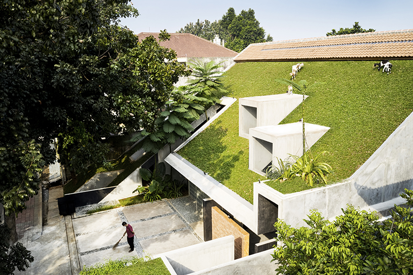 RAD+ar tops tropical residence in indonesia with green steep pitch roof