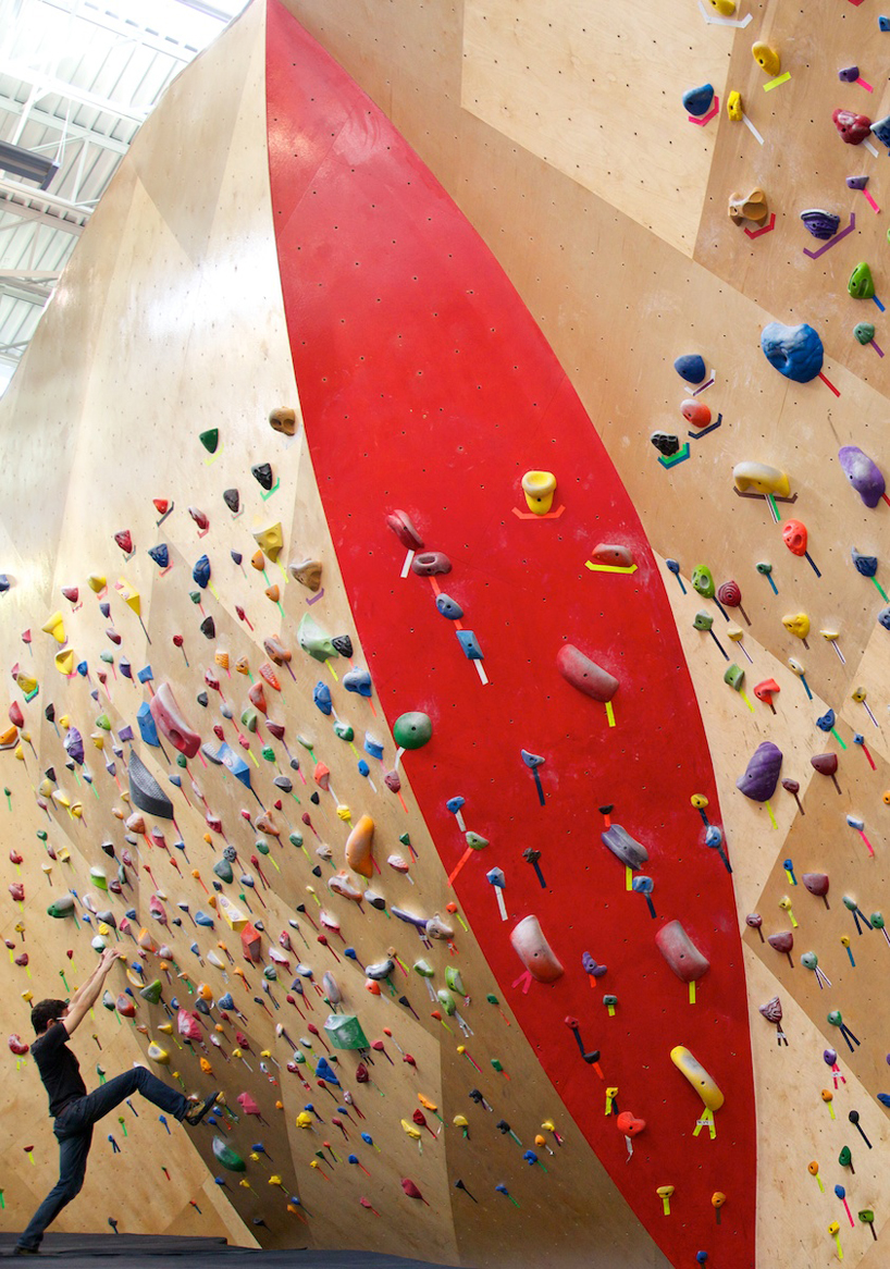 brooklyn boulders coworking space features towering rock climbing wall