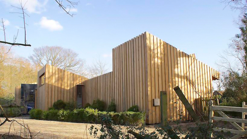 wrapped timber house in the norfolk broads by forrester architects