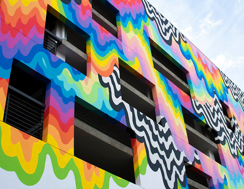 jen stark oozes drippy, technicolor mural across california building façade