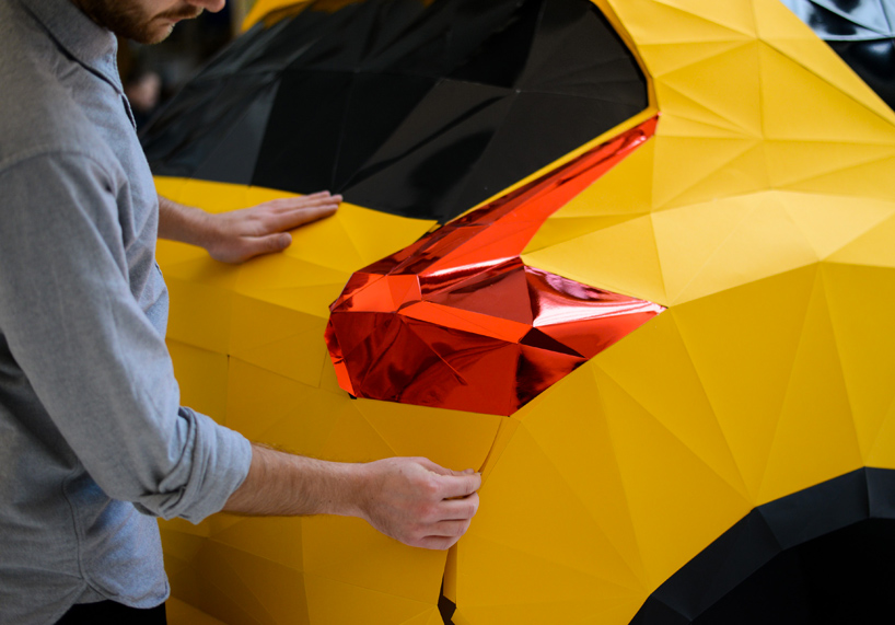 nissan forms full-size origami car with 2,000 folded paper sheets