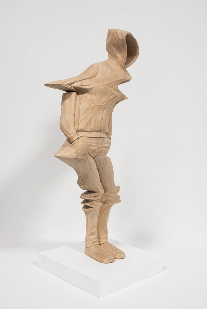 paul kaptein hand carves warped wooden figures with digital glitches