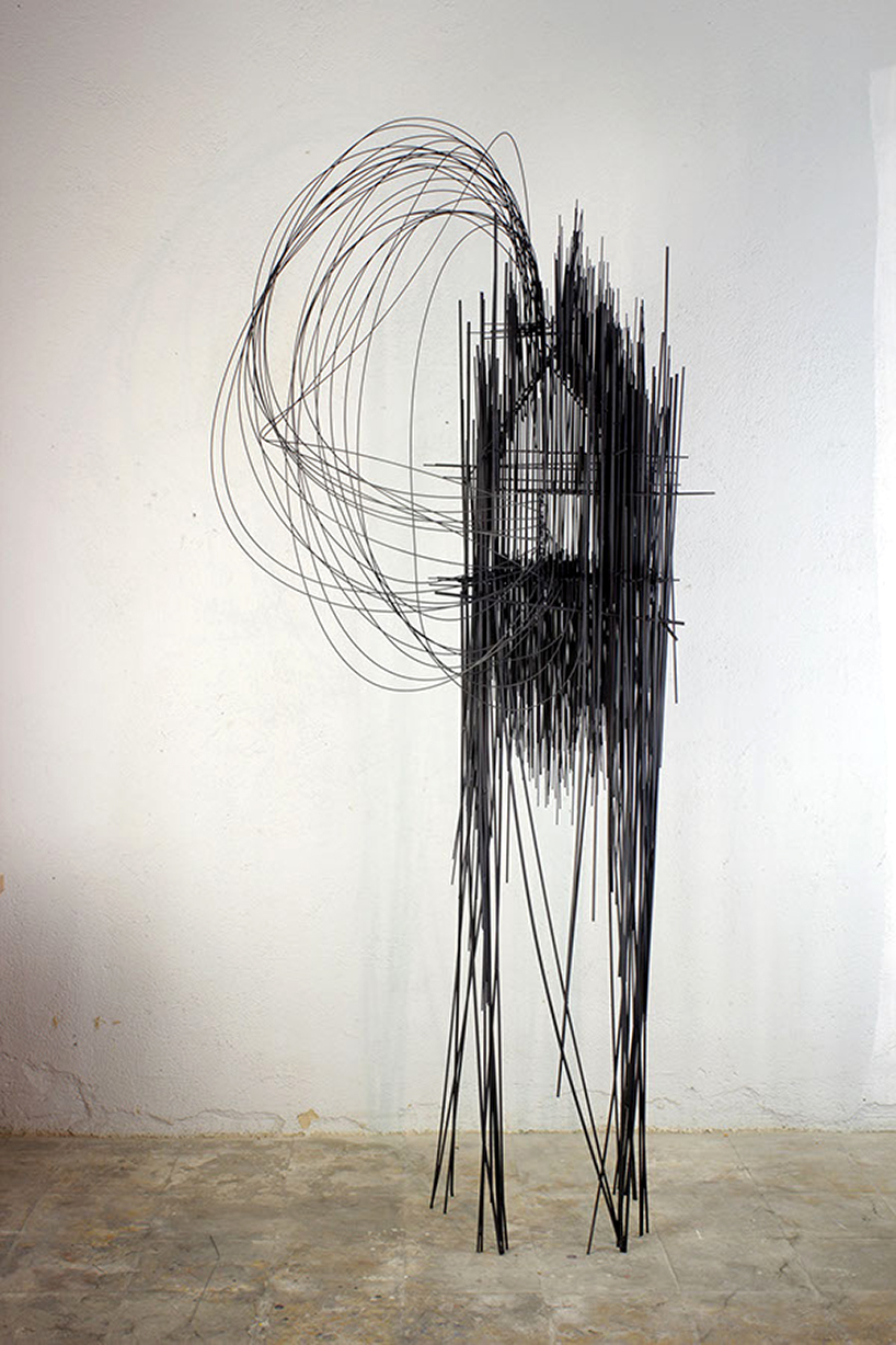 david moreno juxtaposes steel rods to create a series of micro-atmospheres