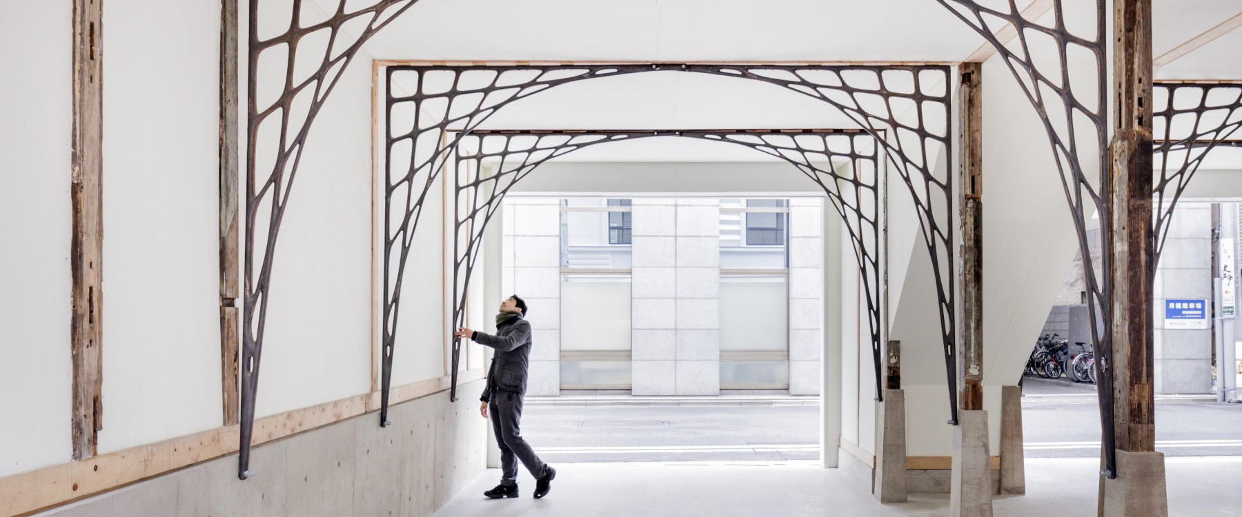 rei mitsui architects adds arched-frame structure to building ...