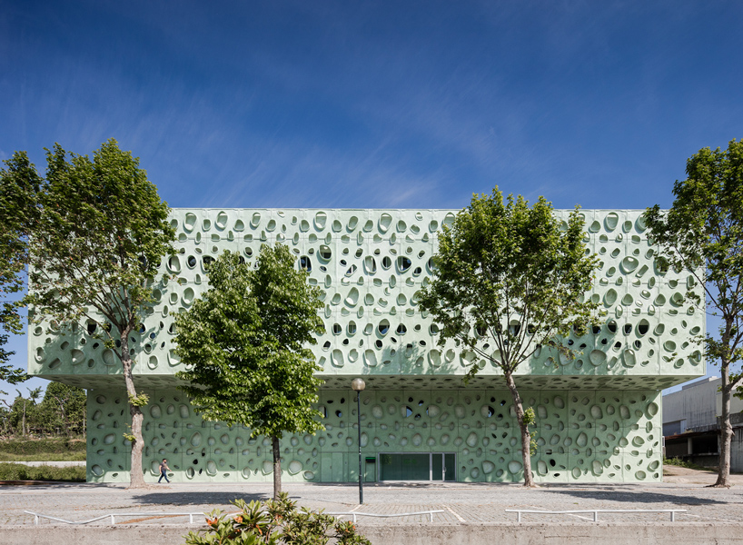 situated in guimarães, portugal, the scheme appears as a monolithic ...