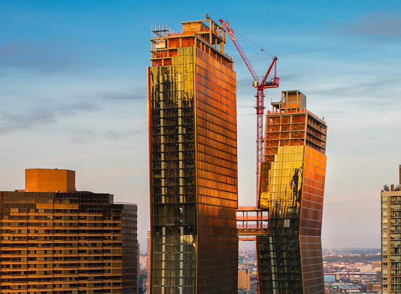 set to complete in 2017, the two copper-clad towers are connected at ...