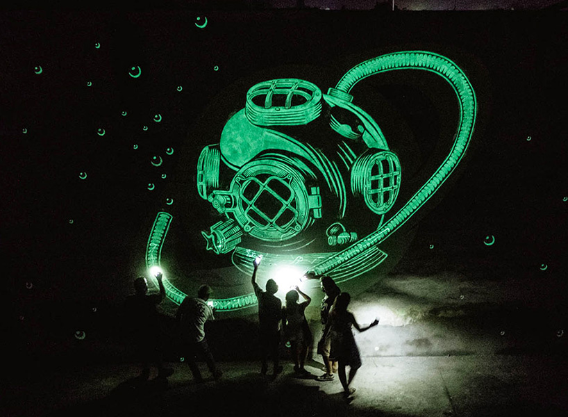 glow-in-the-dark street art by reskate studio reveals secret messages ...