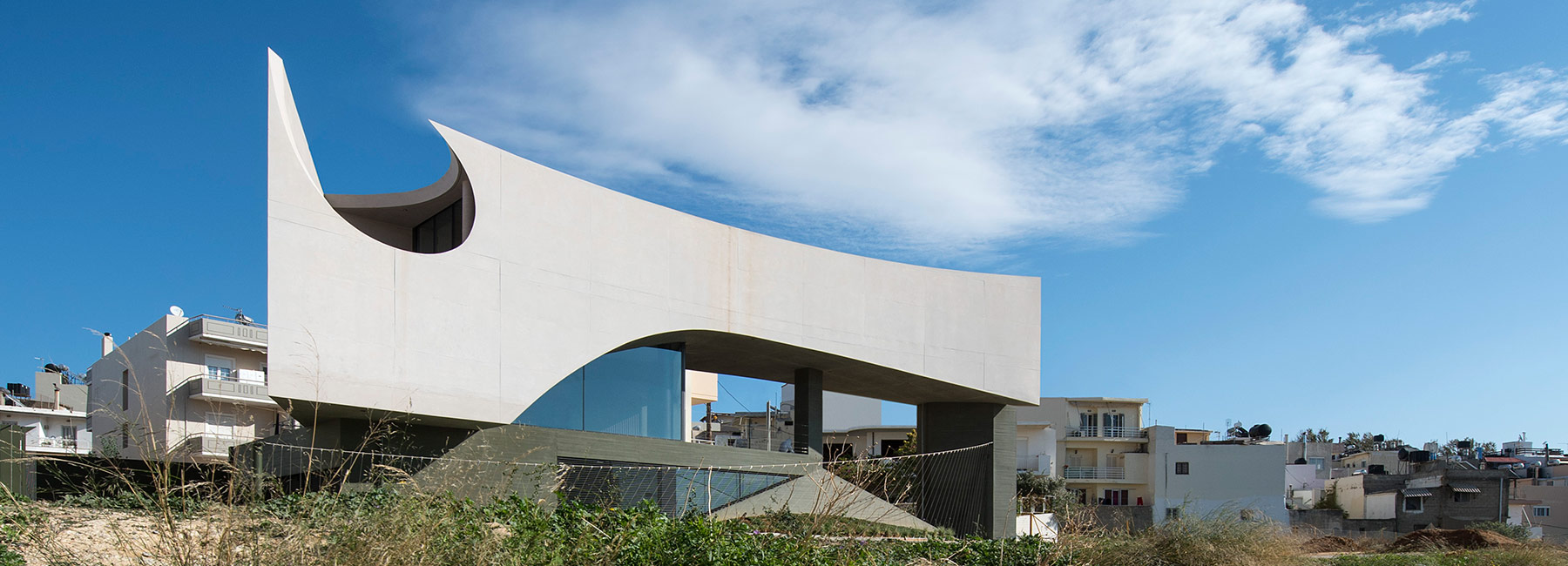 tense architecture network sculpts house in crete from sun angles